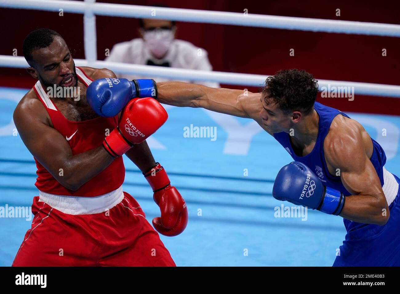 New Zealand's David Nyika, right, lands a punch to Youness Baalla, of ...