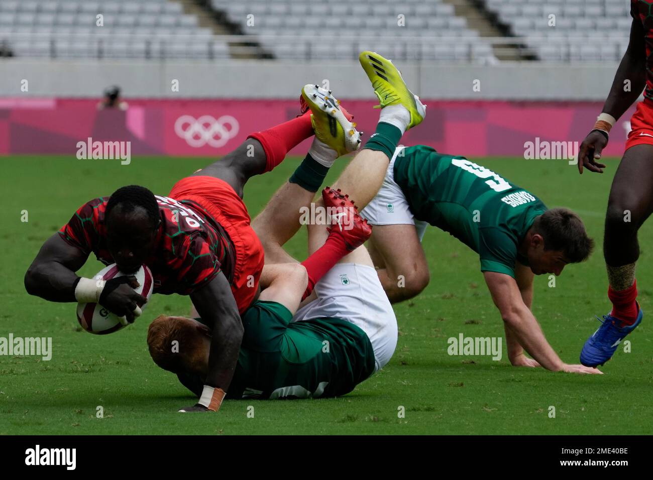 Kenya's Jeff Oluoch is brought down by Ireland's Gavin Mullin, in their ...