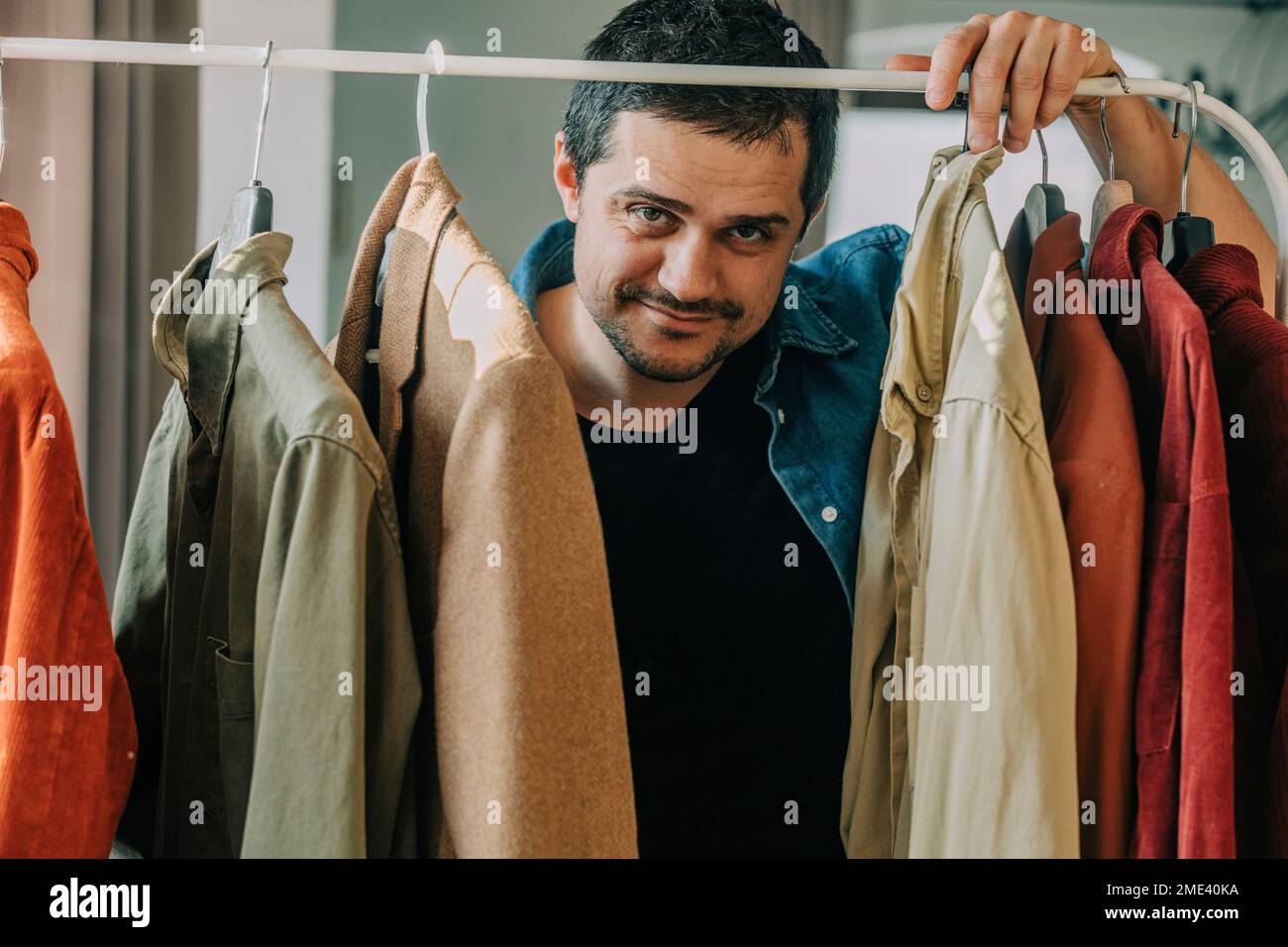Man hanging clothes hi-res stock photography and images - Alamy