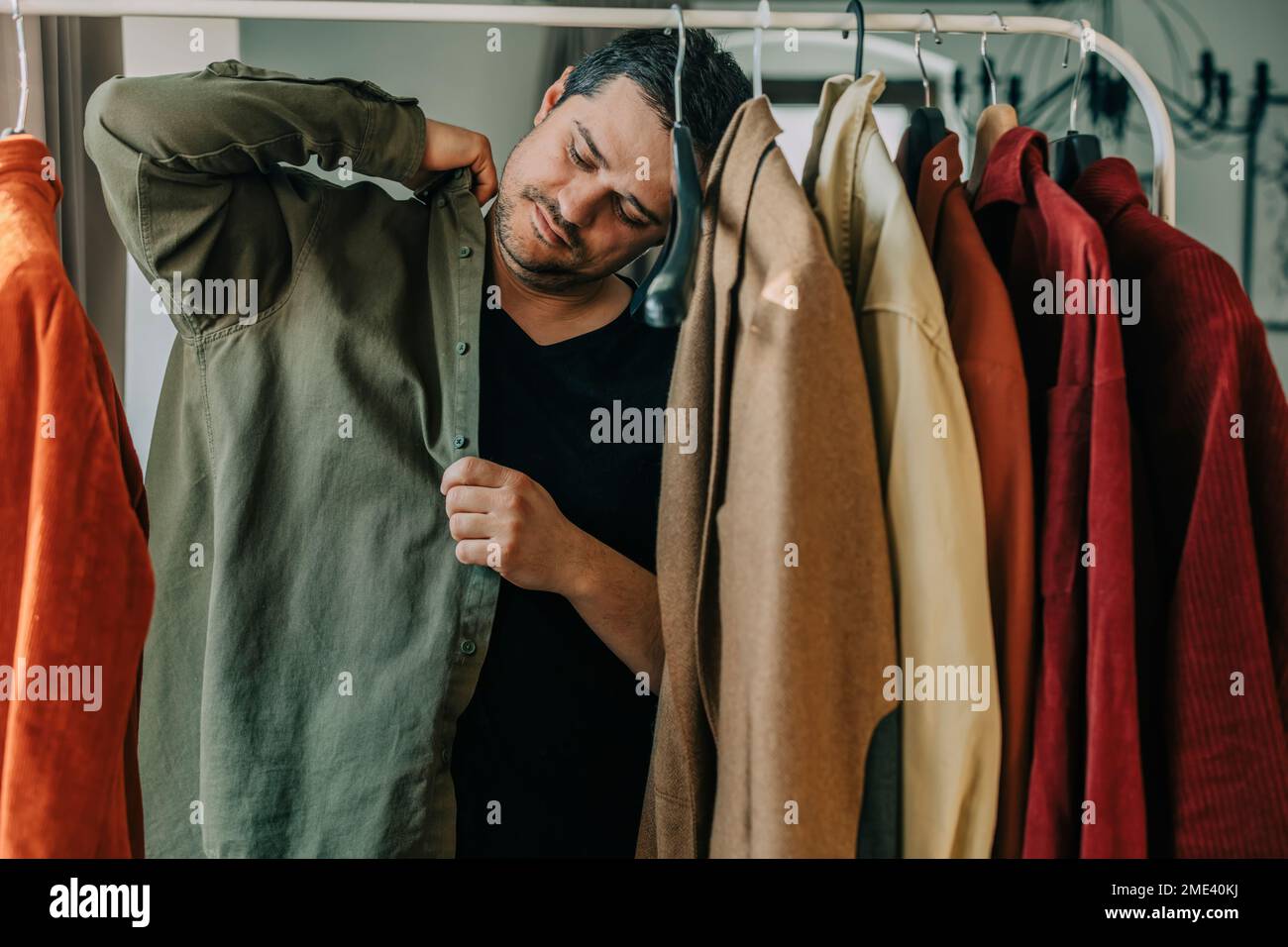 Man choosing shirt hi-res stock photography and images - Alamy