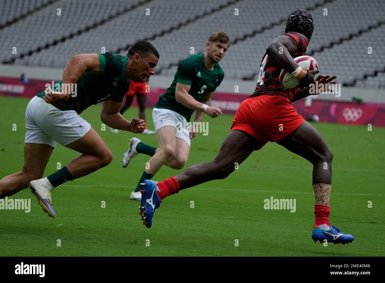 Kenya's Vincent Onyala gets past Ireland's Jordan Conroy, left, and Ian ...