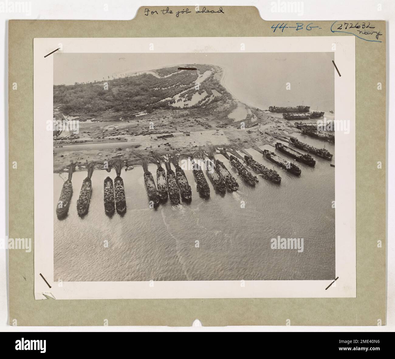 This image shows an armada of LSTs (Landing Ship Tanks) unloading Army ...