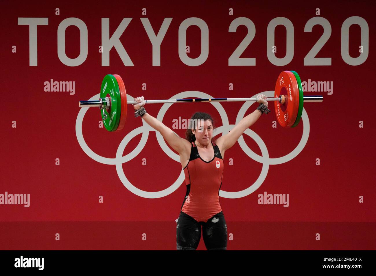 Tali Darsigny of Canada competes in the women's 59k weightlifting event ...