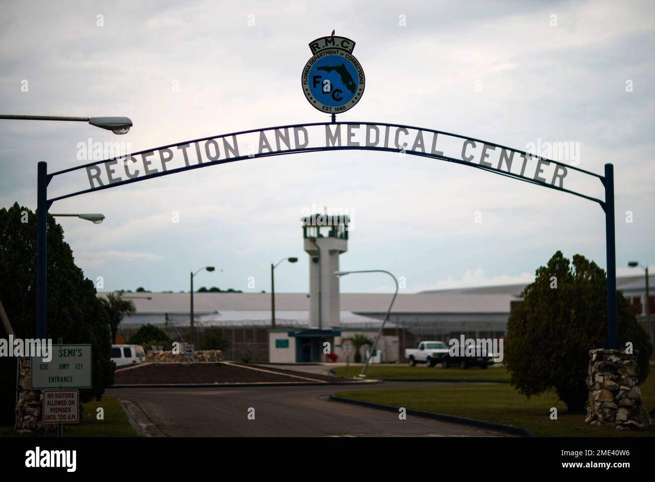A guard tower stands behind the entrance to the Reception and Medical ...
