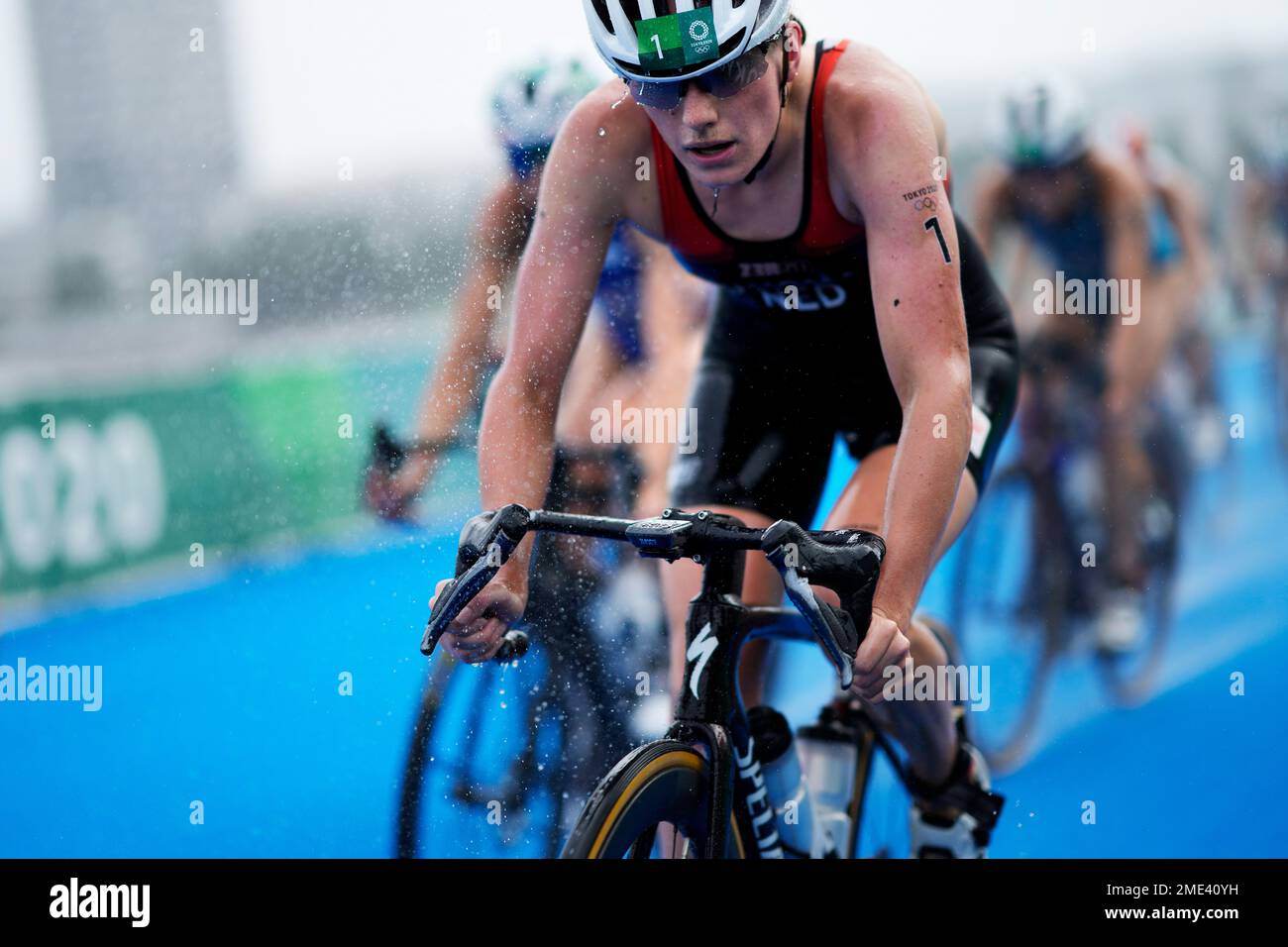 Water falls off the helmet of Maya Kingma, of the Netherlands, as she ...