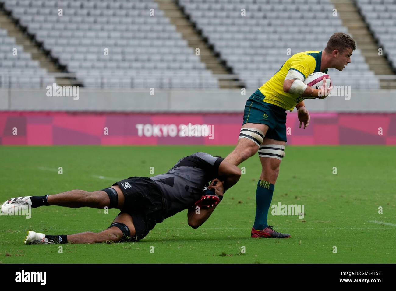 New Zealand's Amanaki Nicole attempts to tackle Australia's Nick Malouf ...