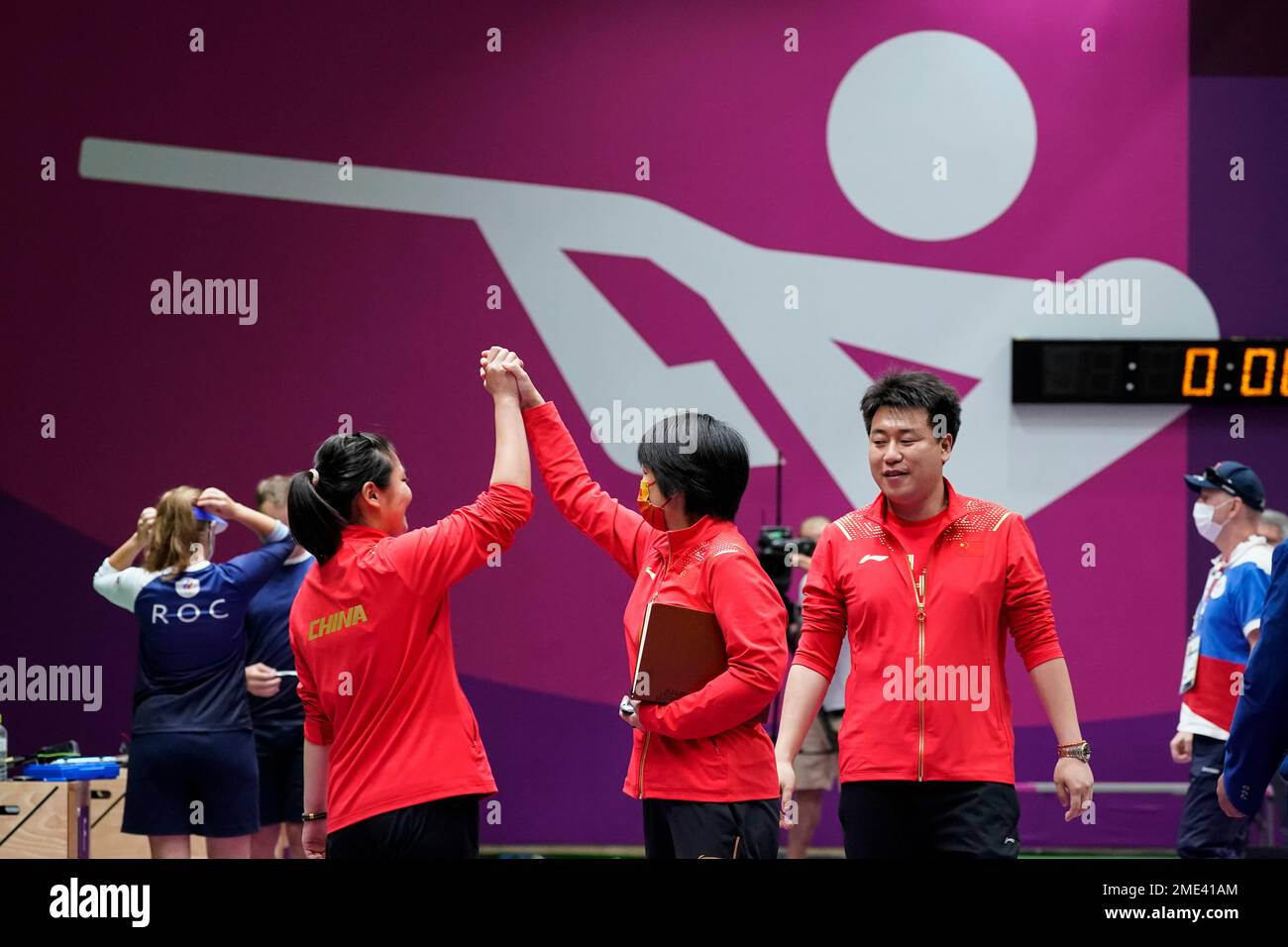 Gold medalists Jiang Ranxin, left, celebrates with her coach, center ...