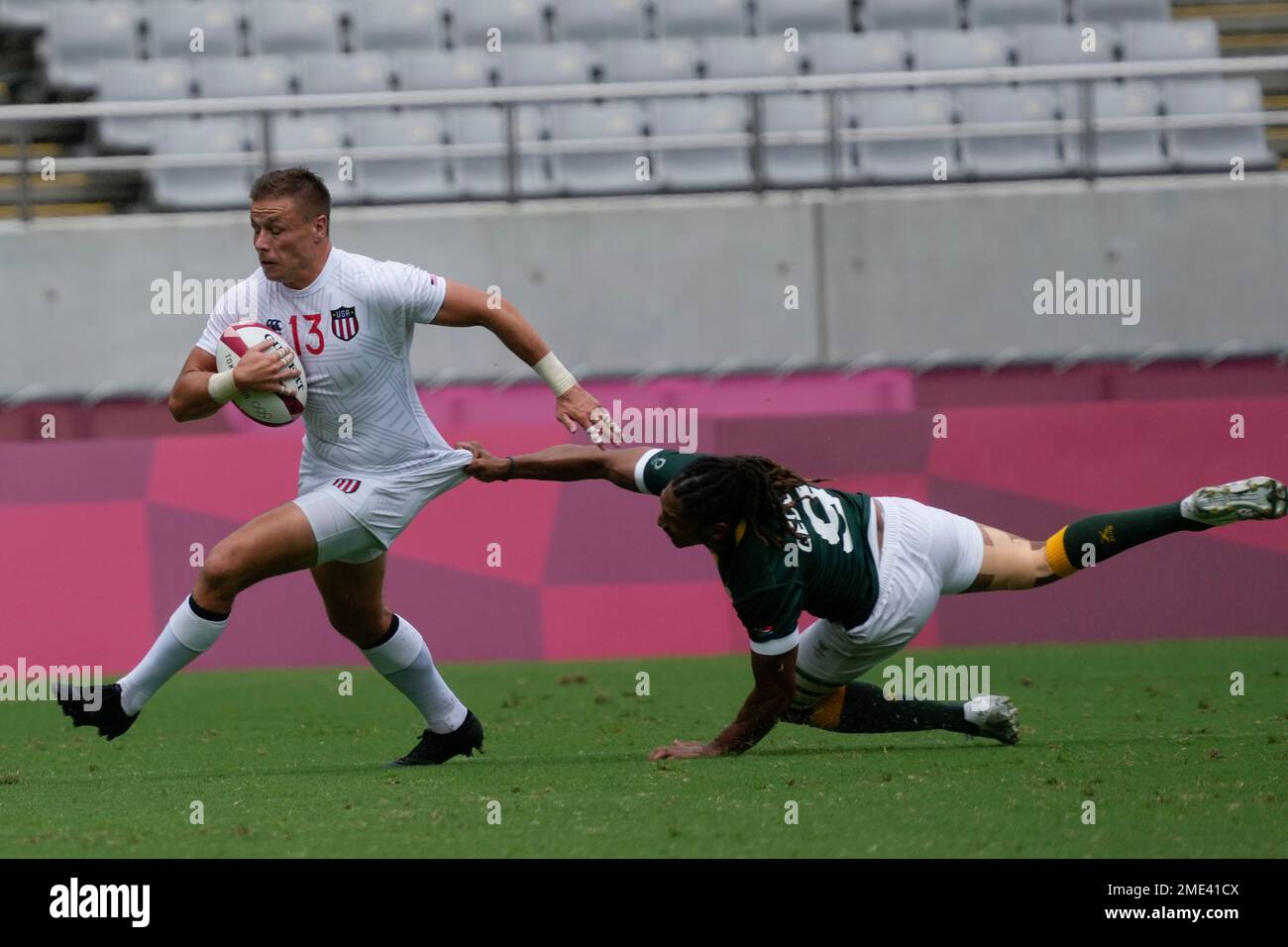 Cody Melphy of the United States is snagged by a diving South Africa's ...