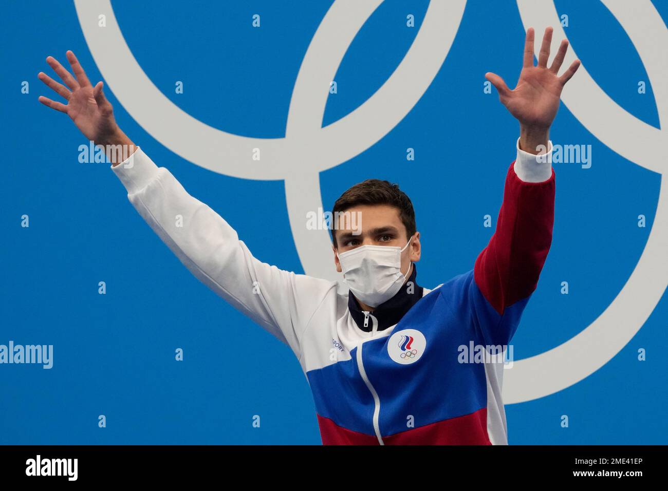Evgeny Rylov, of the Russian Olympic Committee, waves from the medal ...