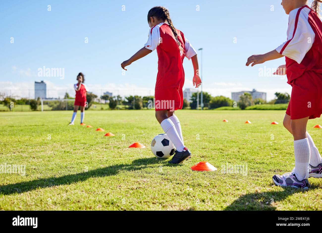 Football, training or sports and a girl team playing with a ball ...