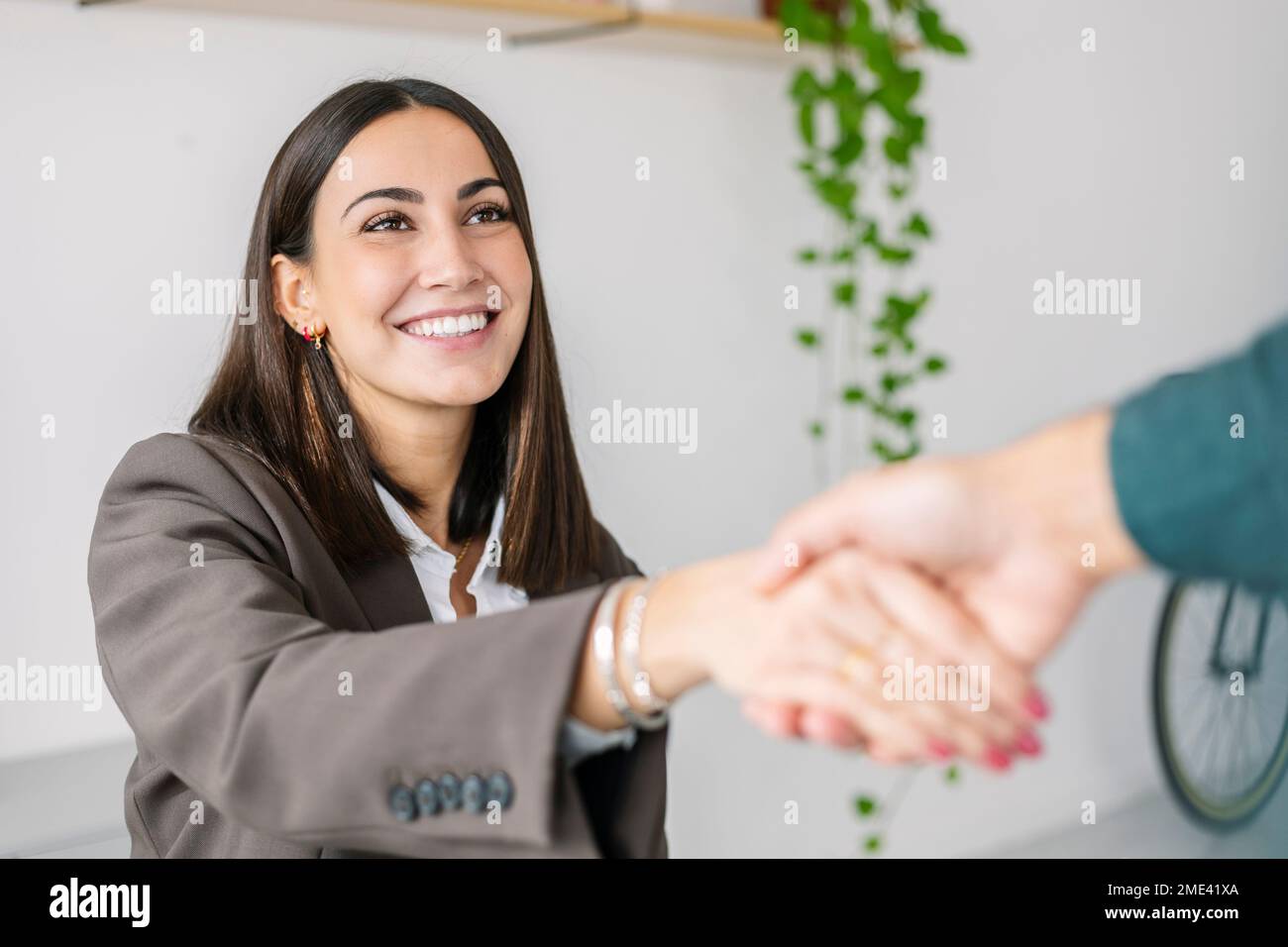 Smiling female candidate shaking hi-res stock photography and images ...