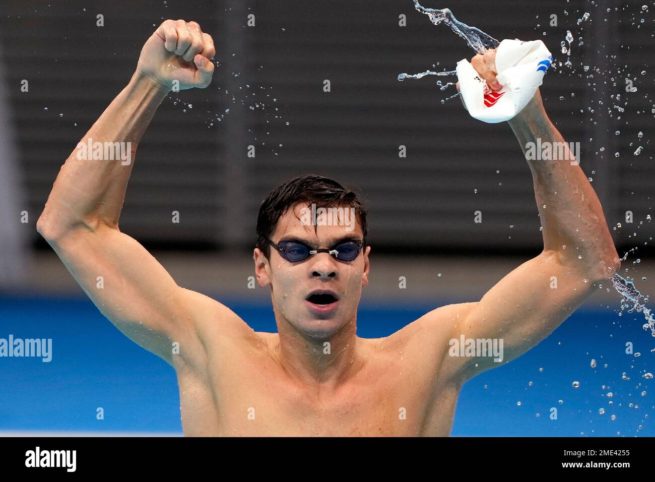Evgeny Rylov of the Russian Olympic Committee celebrates after winning ...