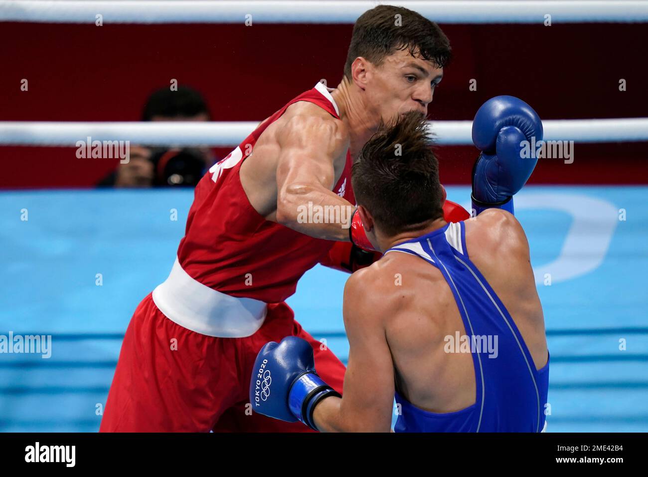 Pat McCormack, of Great Britain, left, lands a punch to Belarus ...