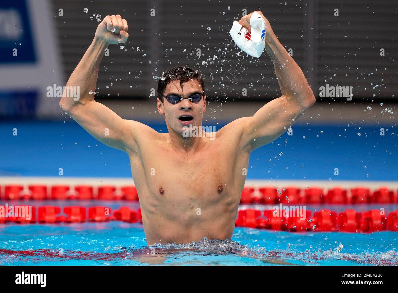 Evgeny Rylov of the Russian Olympic Committee celebrates after winning ...
