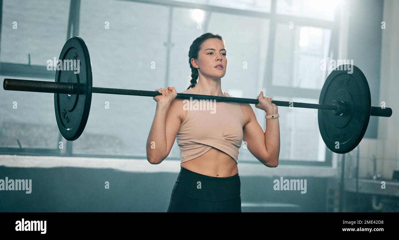 Gym, barbell workout and girl doing muscle fitness performance, body ...