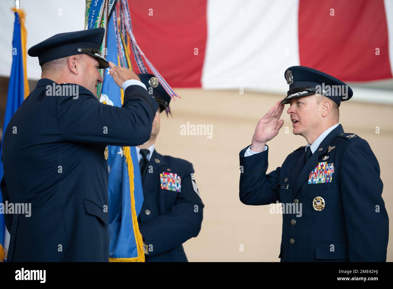 U.S. Air Force Col. Derek Salmi, right, accepts command of the 60th Air ...