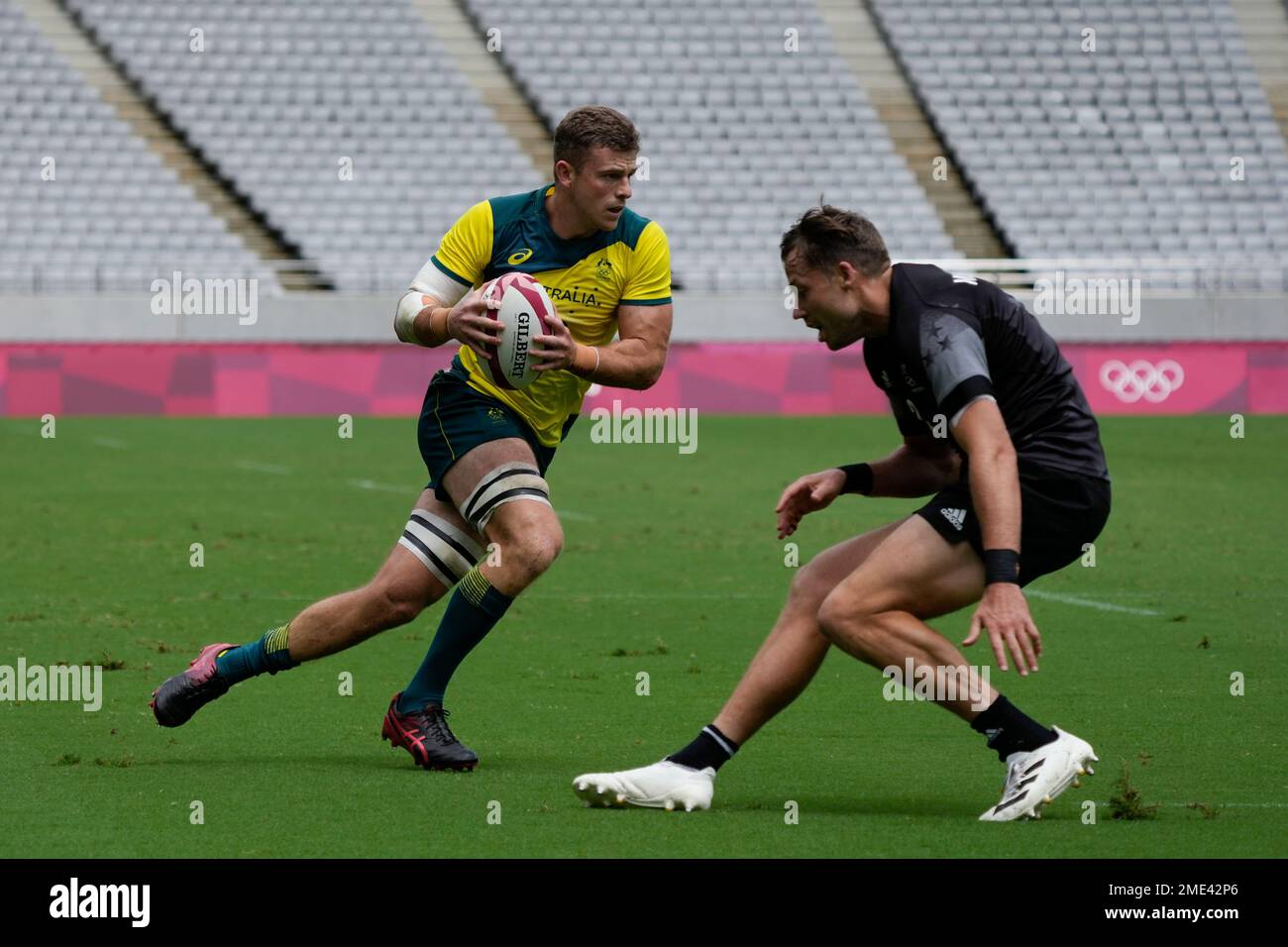 Australia's Nick Malouf, left, is challenged by New Zealand's Tim ...
