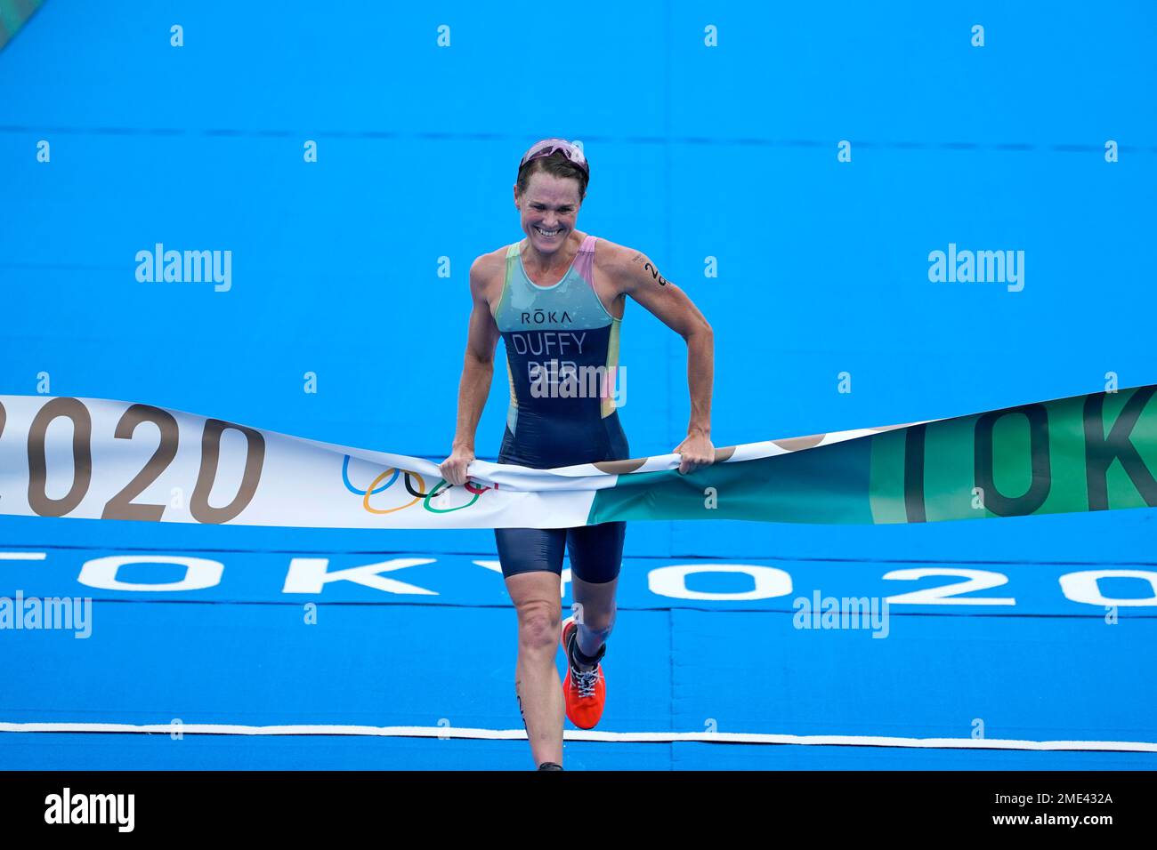 Flora Duffy of Team Bermuda celebrates as she crosses the finish line ...