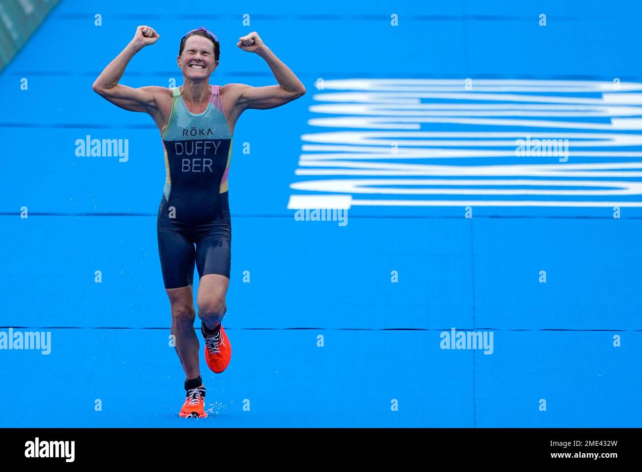Flora Duffy of Team Bermuda celebrates as she approaches the finish ...
