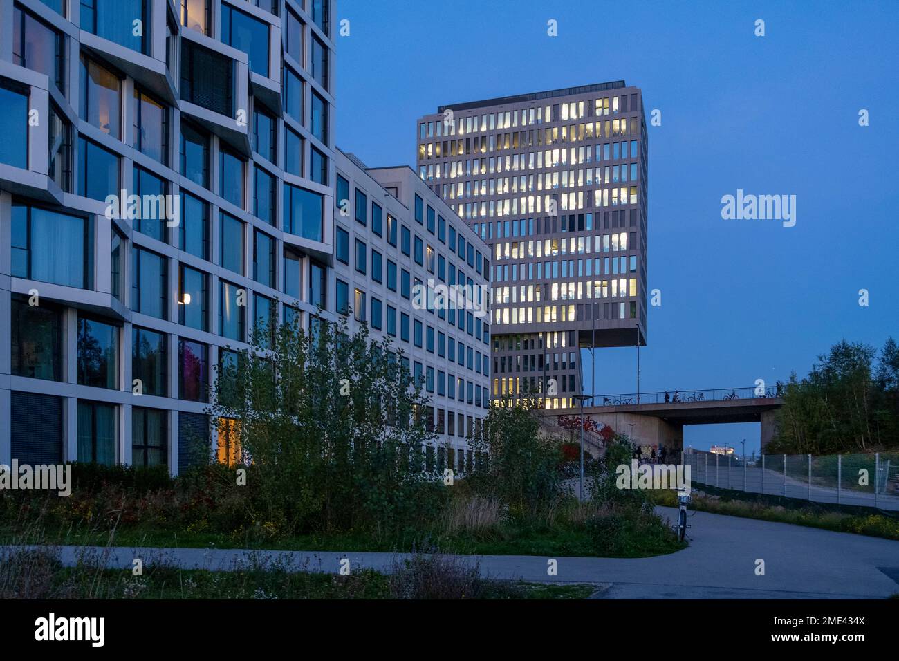 Germany, Bavaria, Munich, Modern office buildings at dusk Stock Photo ...