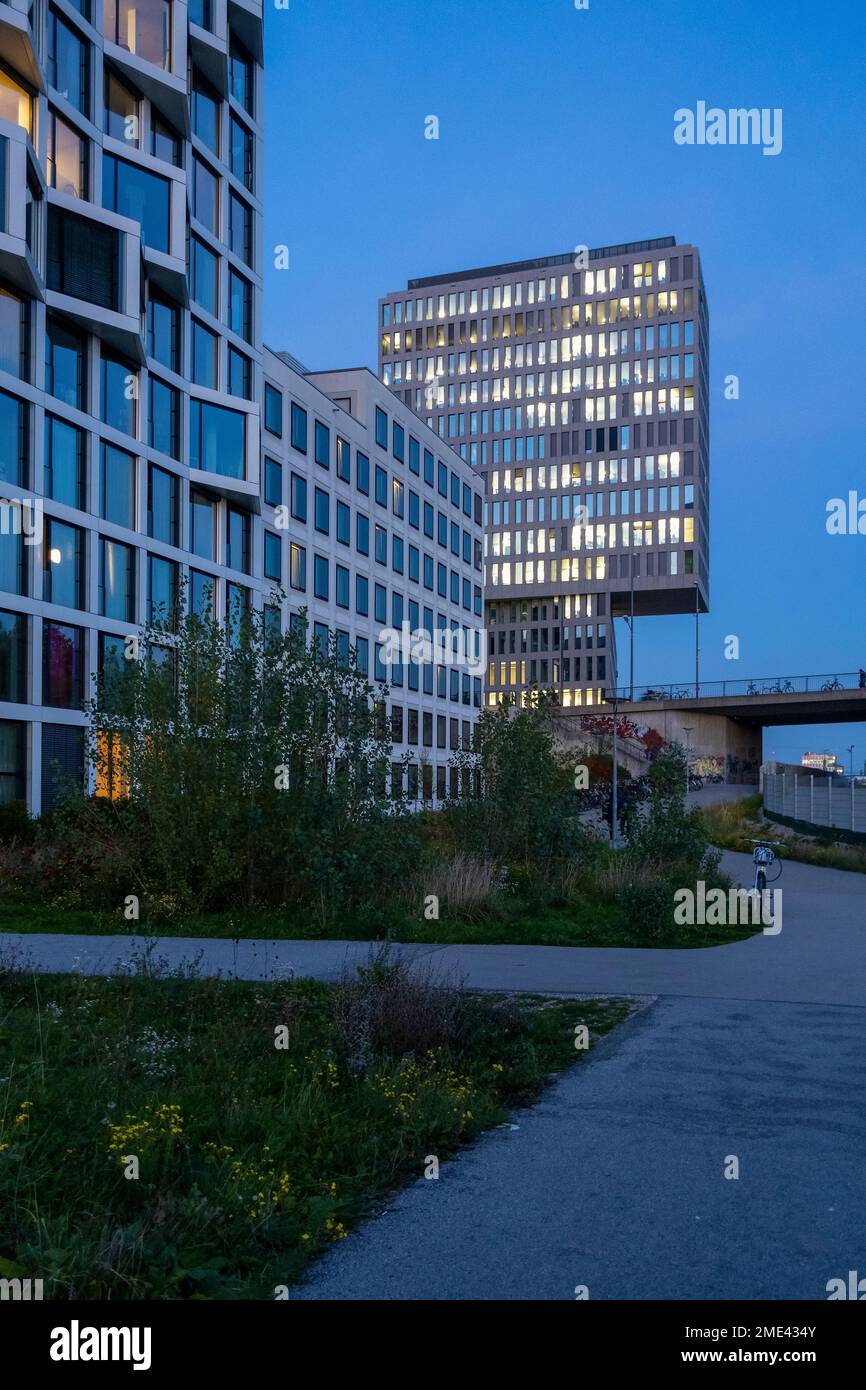 Germany, Bavaria, Munich, Modern office buildings at dusk Stock Photo ...