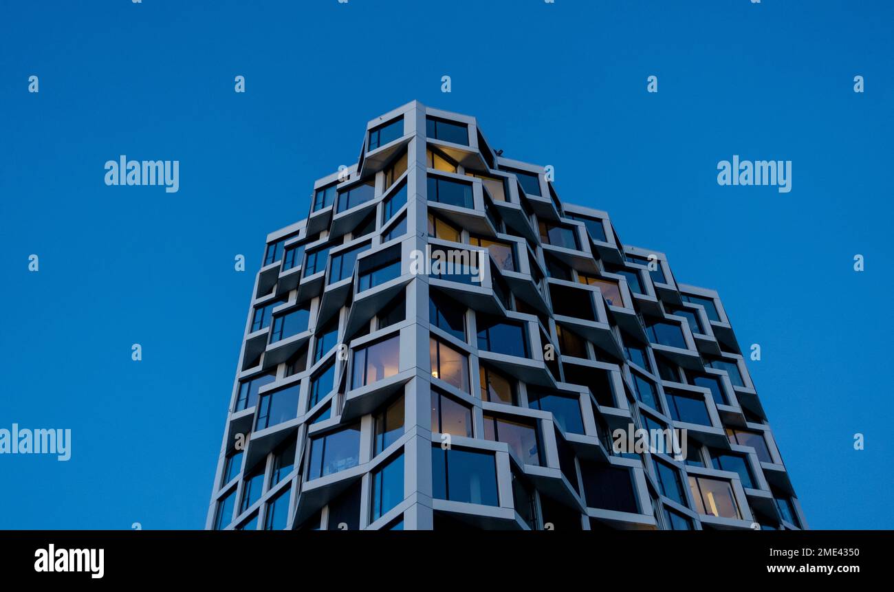 Germany, Bavaria, Munich, Exterior of highrise building at dusk Stock ...