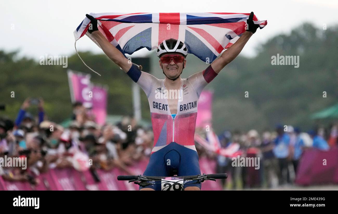 Thomas Pidcock of Great Britain celebrates as he wins the gold medal ...