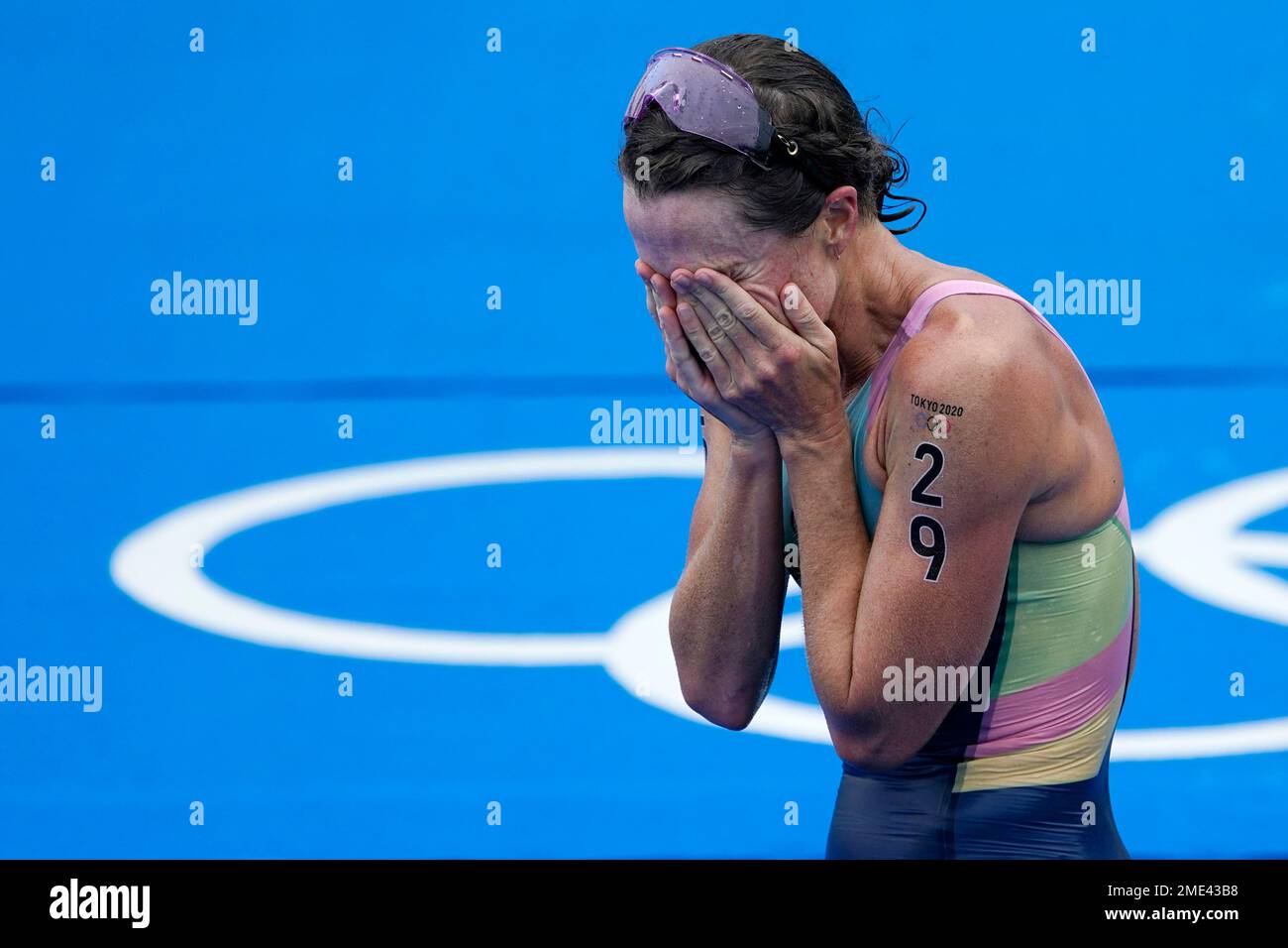 Flora Duffy of Bermuda celebrates after crossing the finish line to win ...