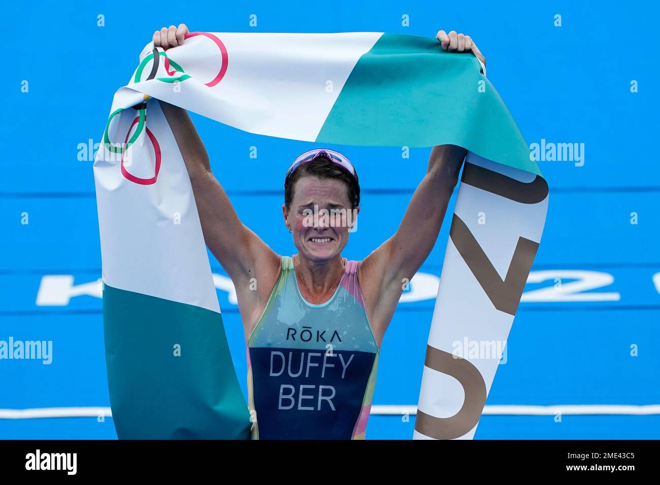 Flora Duffy of Bermuda celebrates after crossing the finish line to win ...