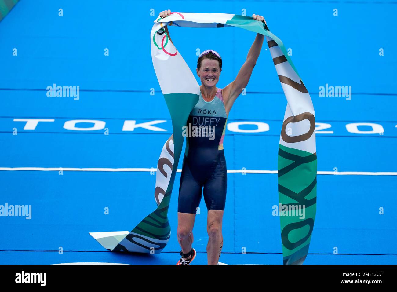 Flora Duffy of Bermuda celebrates after crossing the finish line to win ...