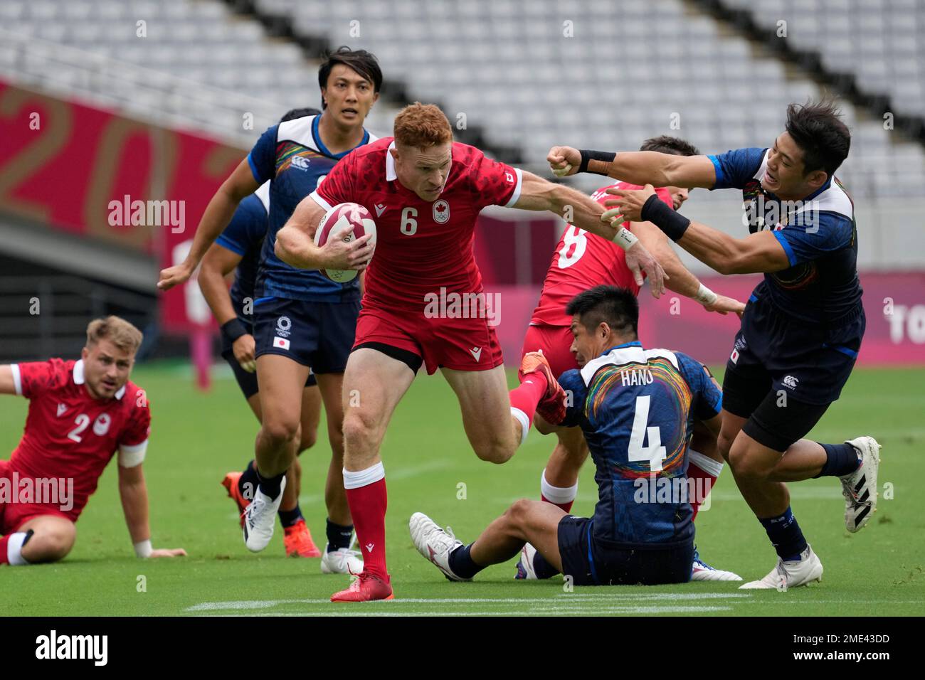 Canada's Connor Braid gets past Japan's Yoshikazu Fujita, right, and ...