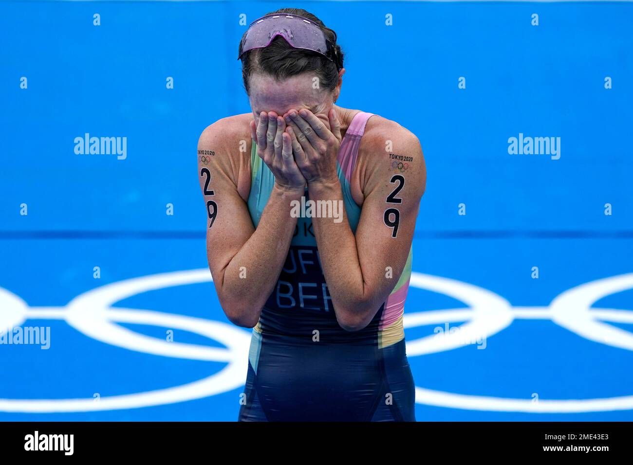 Flora Duffy of Bermuda celebrates after crossing the finish line to win ...