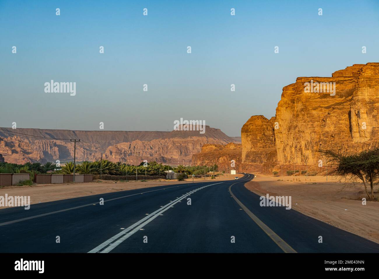 Saudi Arabia, Al-Ula, Desert highway with sandstone cliffs in ...