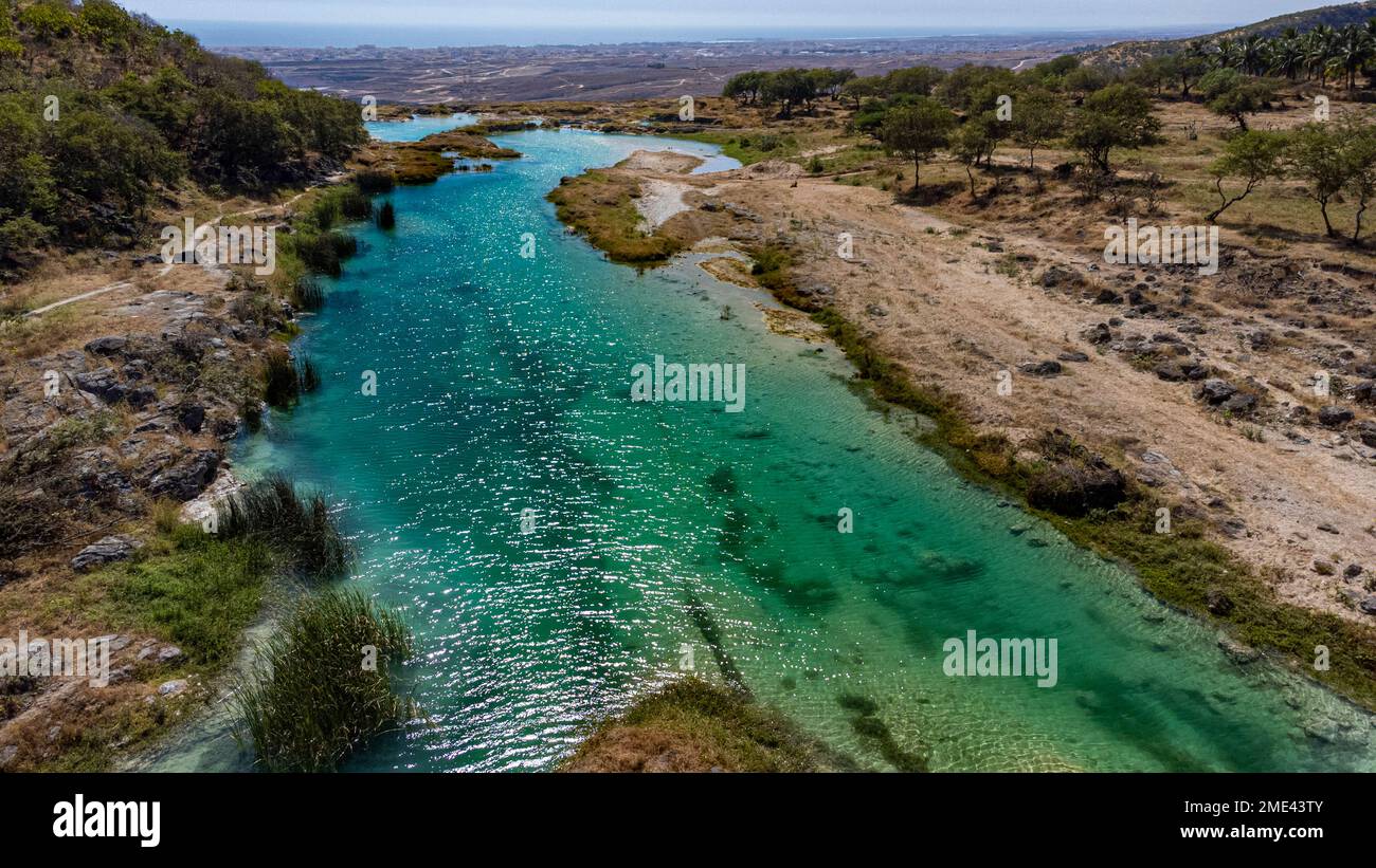 Oman, Dhofar, Salalah, Aerial view of Wadi Darbat river in sunshine ...