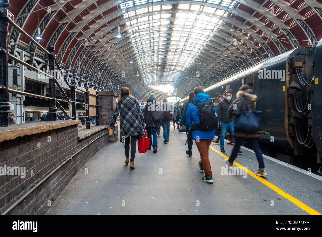 People walking along the platform at Paddington Station in London ...