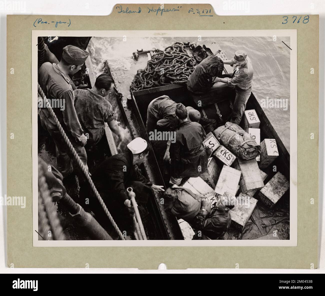 Coast Guardsmen are seen loading boxes of 'K' Rations onto an Army ...