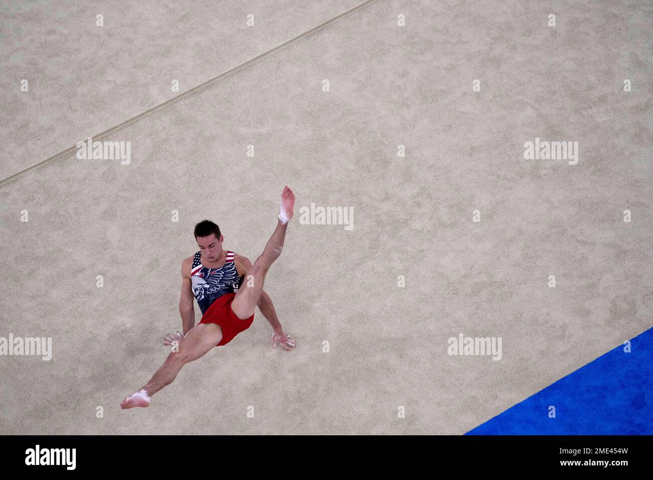 Samuel Mikulak, of the United States, performs on the floor exercise ...