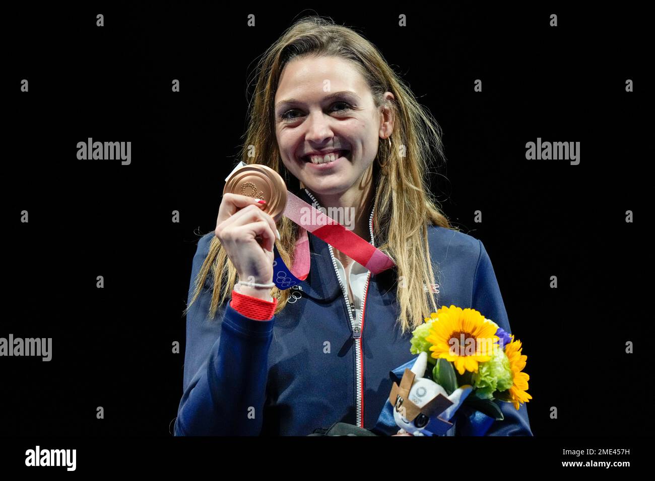 Manon Brunet of France holds the bronze medal as she celebrates on the ...