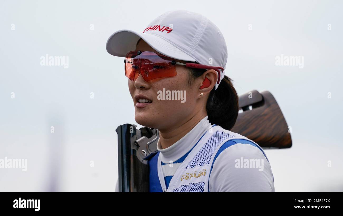 Wei Meng, of China, pauses as she competes in the women's skeet at the ...