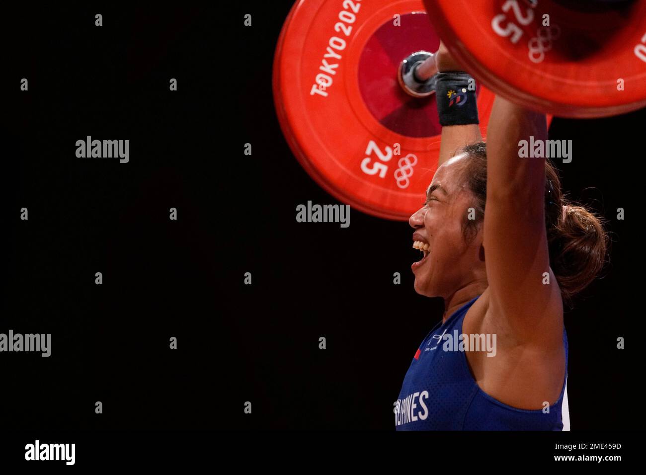 Hidilyn Diaz of Philippines celebrates as she competes and sets new ...