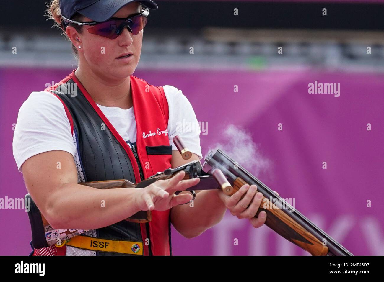 Amber English, of the United States, tosses her shells as she competes ...