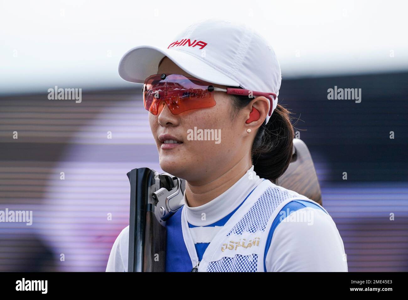 Wei Meng, of China, pauses as she competes in the women's skeet at the ...