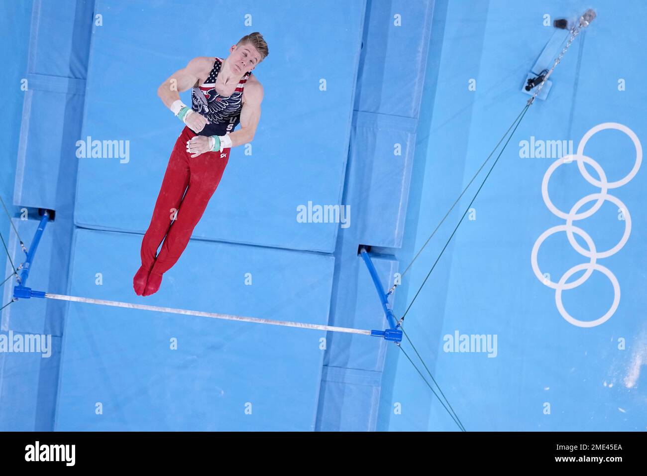 Shane Wiskus, of the United States, performs on the horizontal bar ...