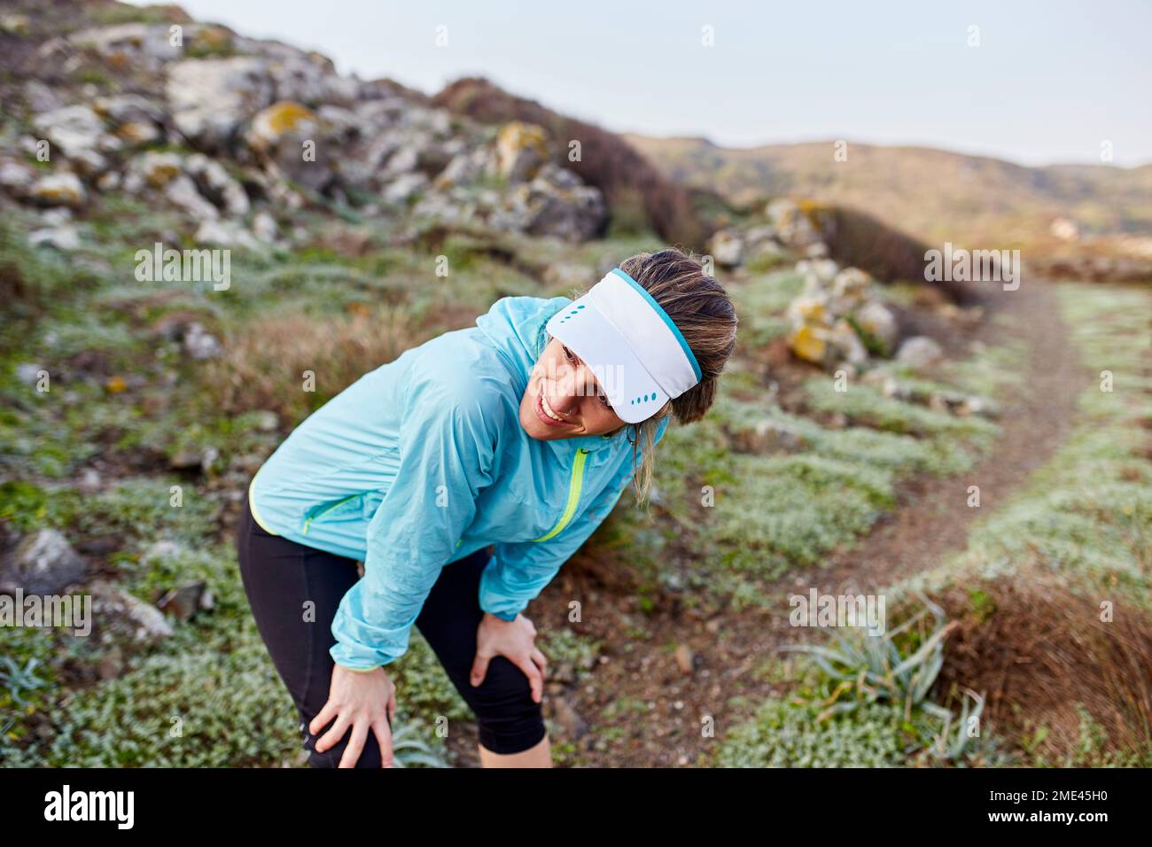 Happy trail runner taking break after run Stock Photo - Alamy