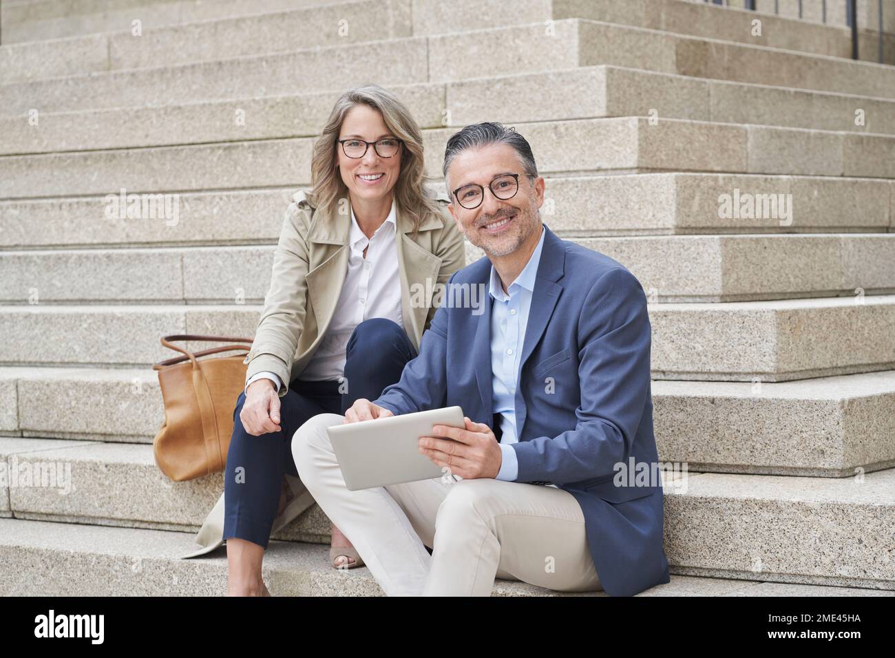 Business people sitting on steps hi-res stock photography and images ...