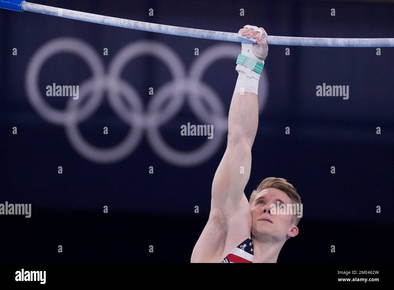 Shane Wiskus, of the United States, performs on the horizontal bar ...
