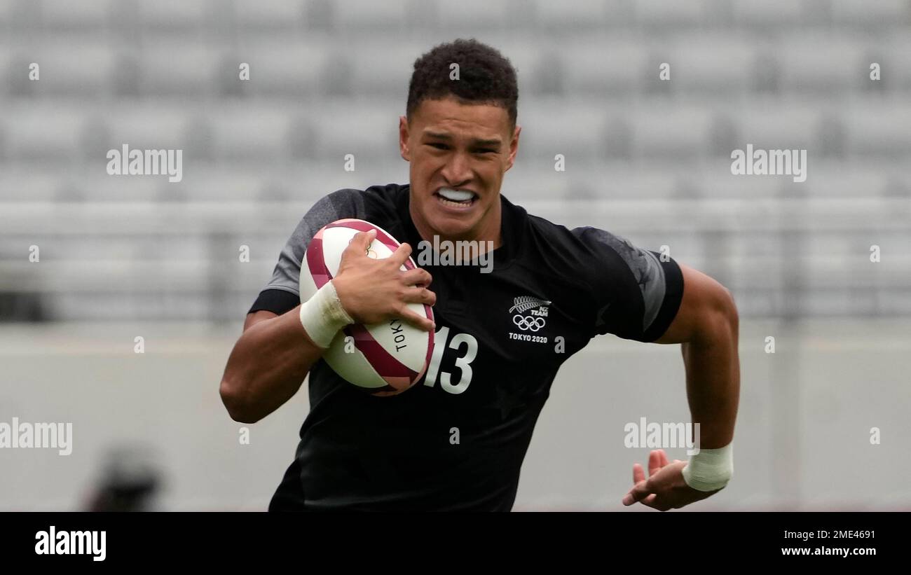 William Warbrick of New Zealand runs with a ball against South Korea ...