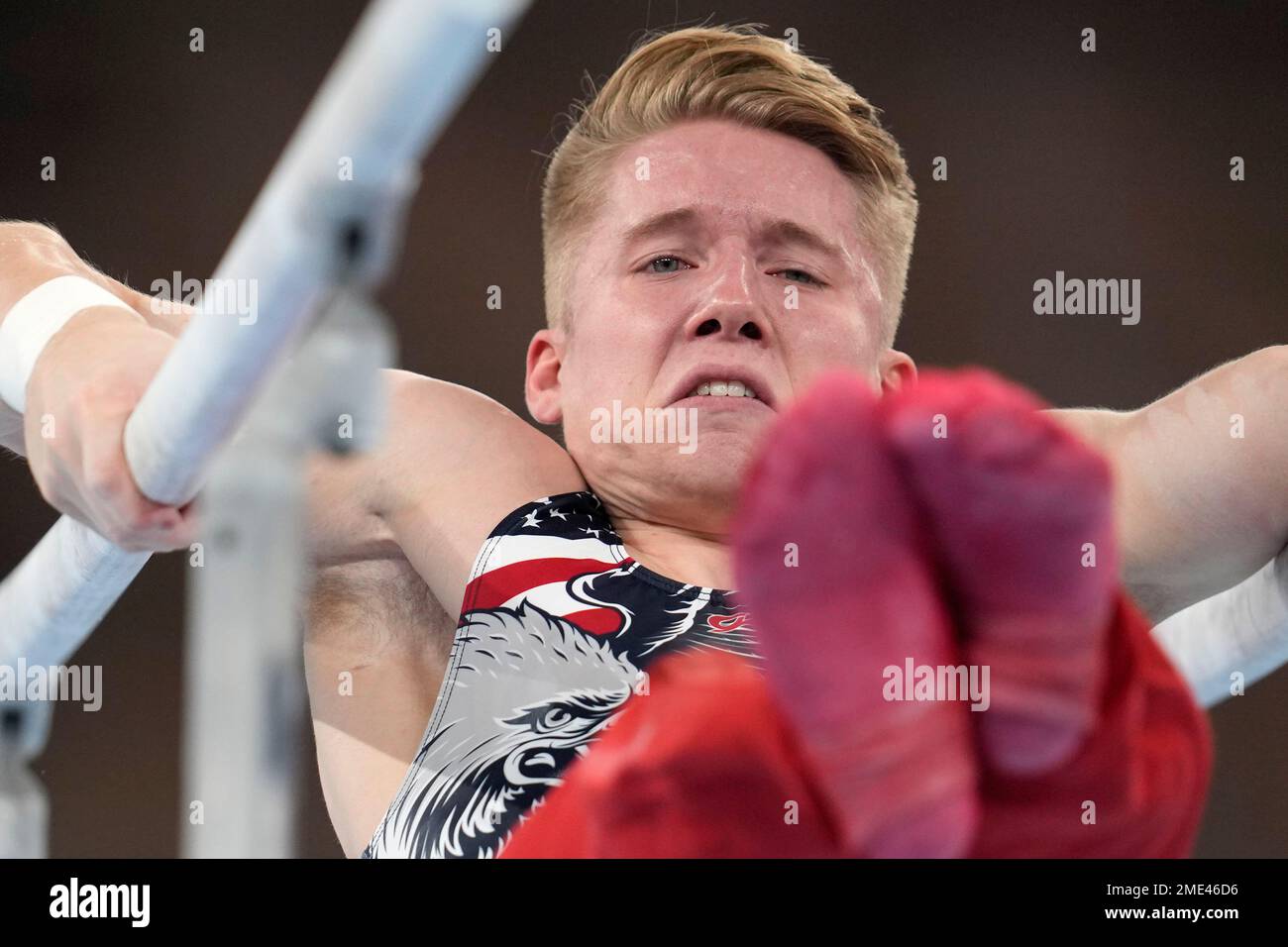 Shane Wiskus, of the United States, performs on the parallel bars ...