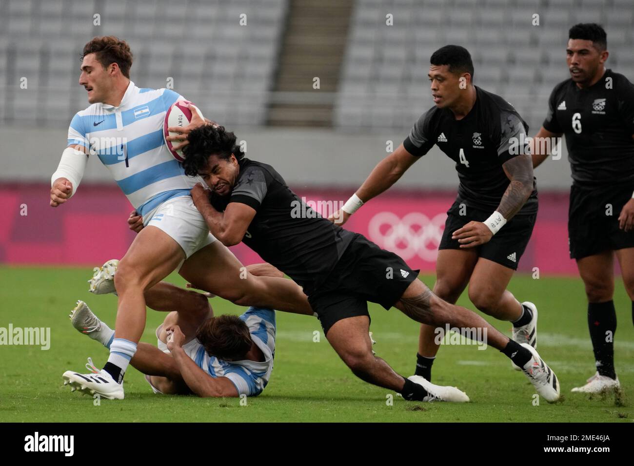 Argentina's Rodrigo Isgro is tackled by New Zealand's Regan Ware, in ...
