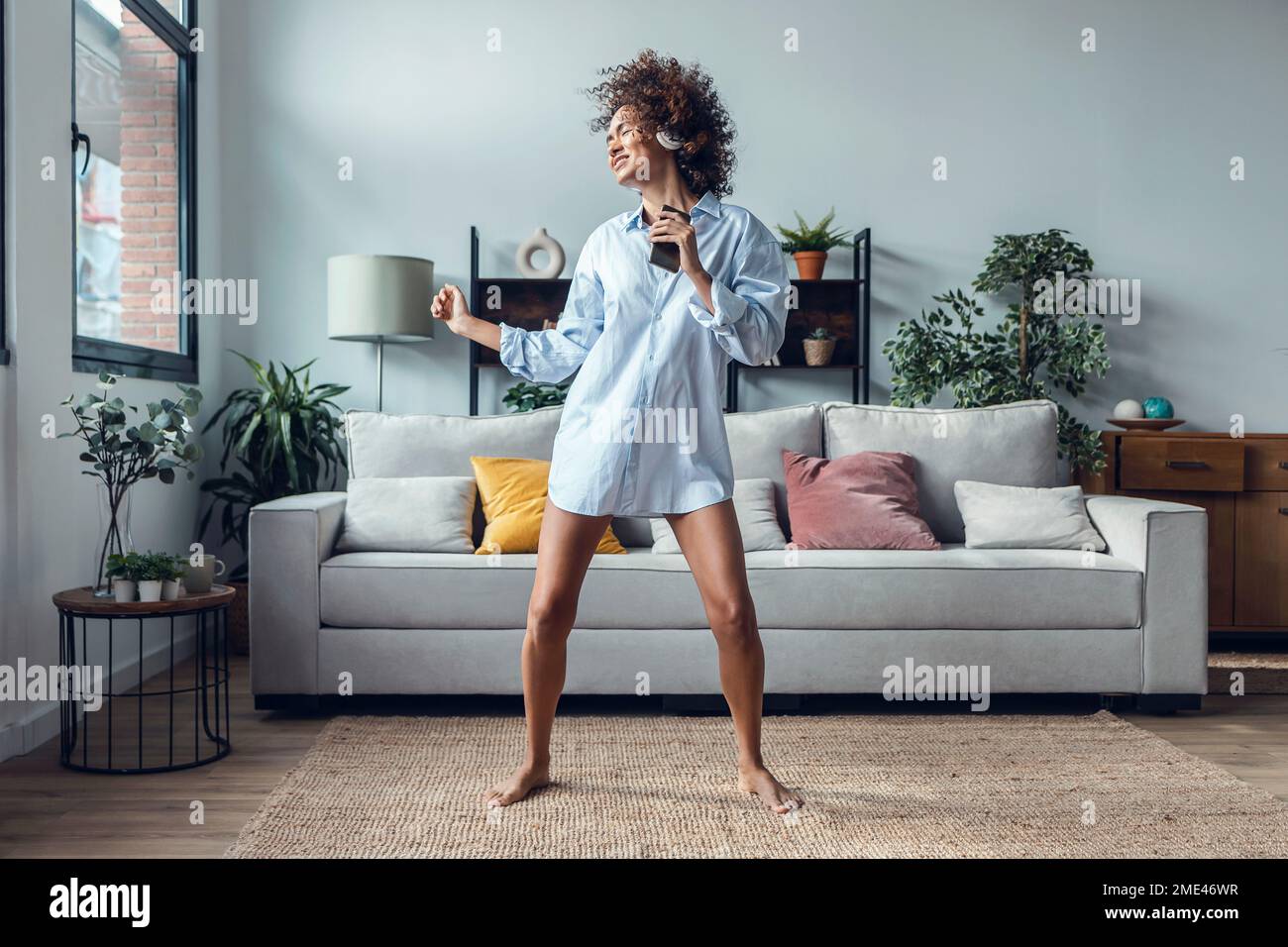 Woman dancing living room hi-res stock photography and images - Alamy